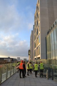 Staff plant trees at new hospital building - UHSussex
